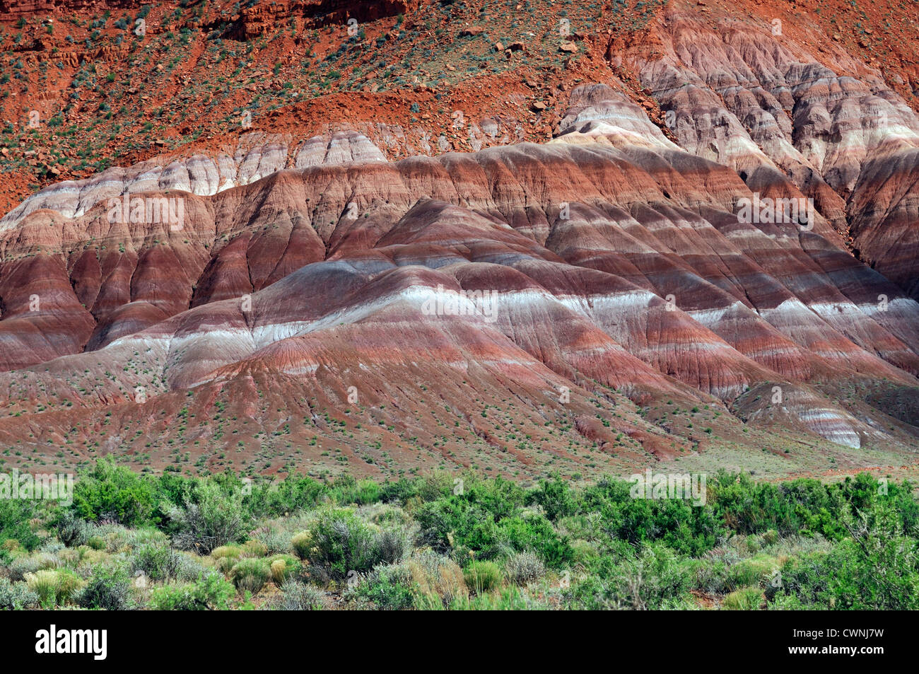 orange brown red colored coloured sandstone cliffs hills along highway ...