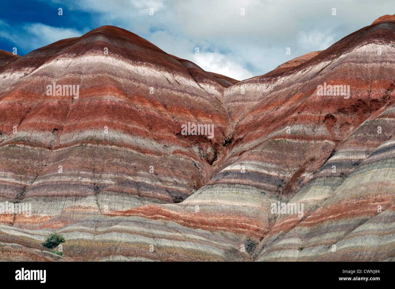orange brown red colored coloured sandstone cliffs hills along highway ...