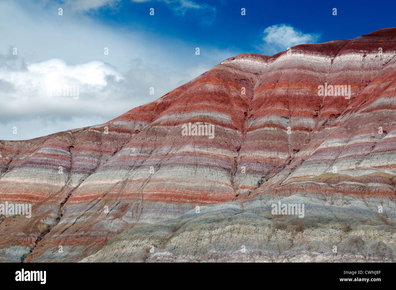 orange brown red colored coloured sandstone cliffs hills along highway ...