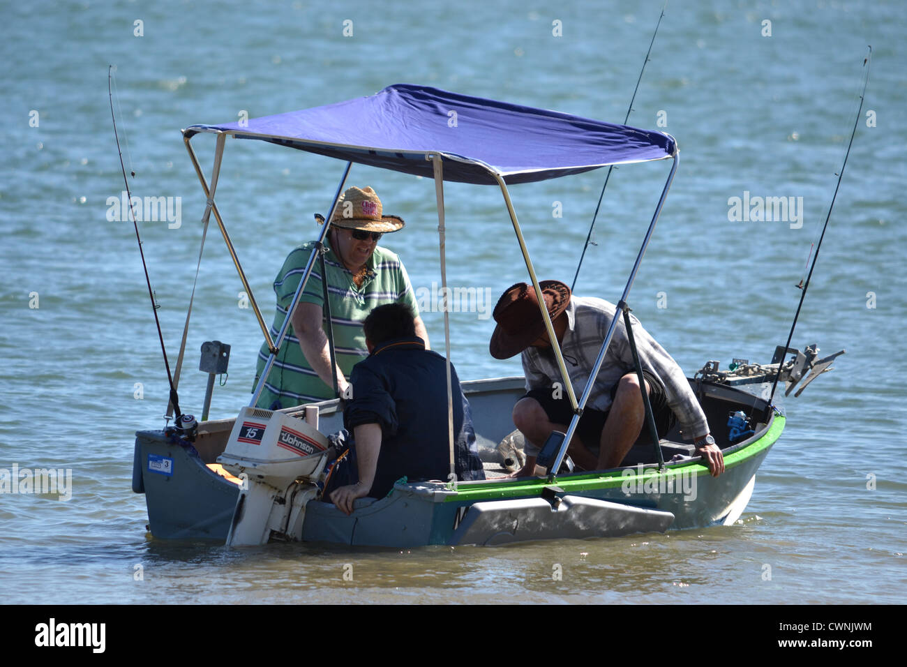 Three men going fishing in their tinny Stock Photo - Alamy