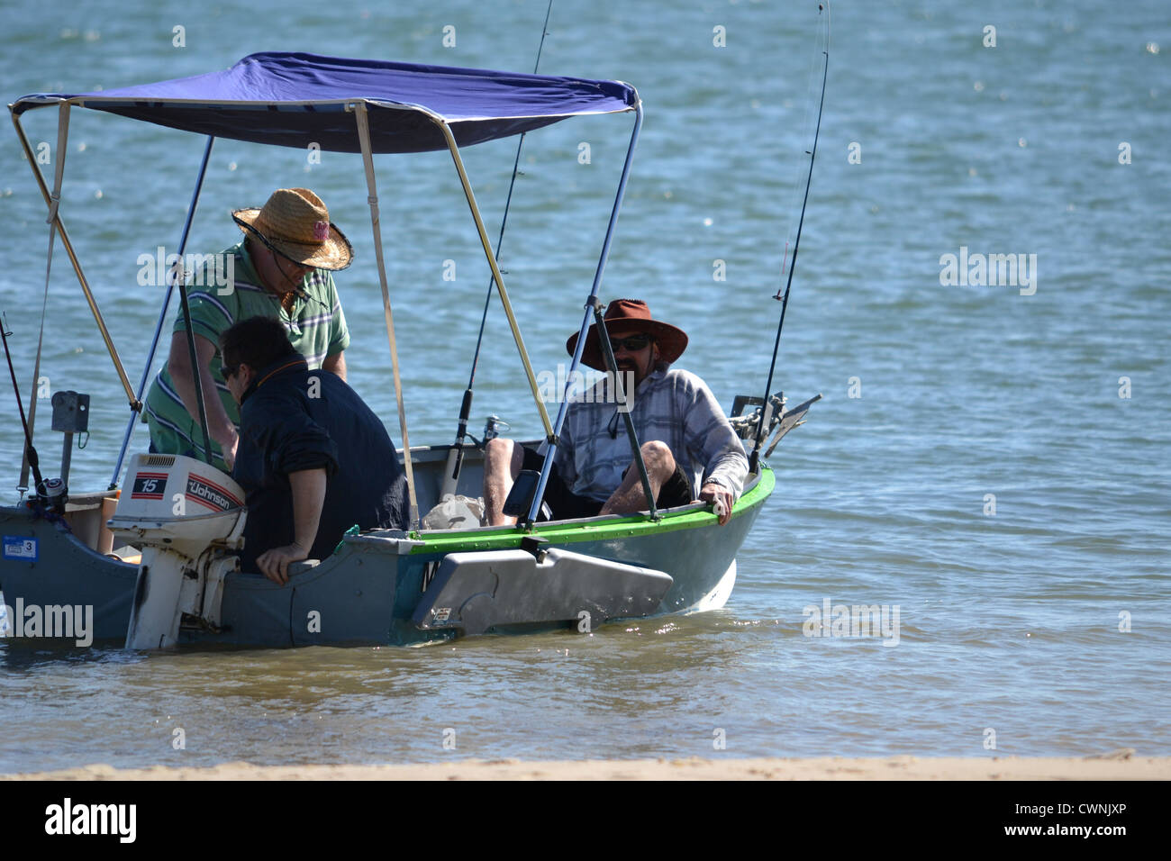 Three men going fishing in their tinny Stock Photo - Alamy