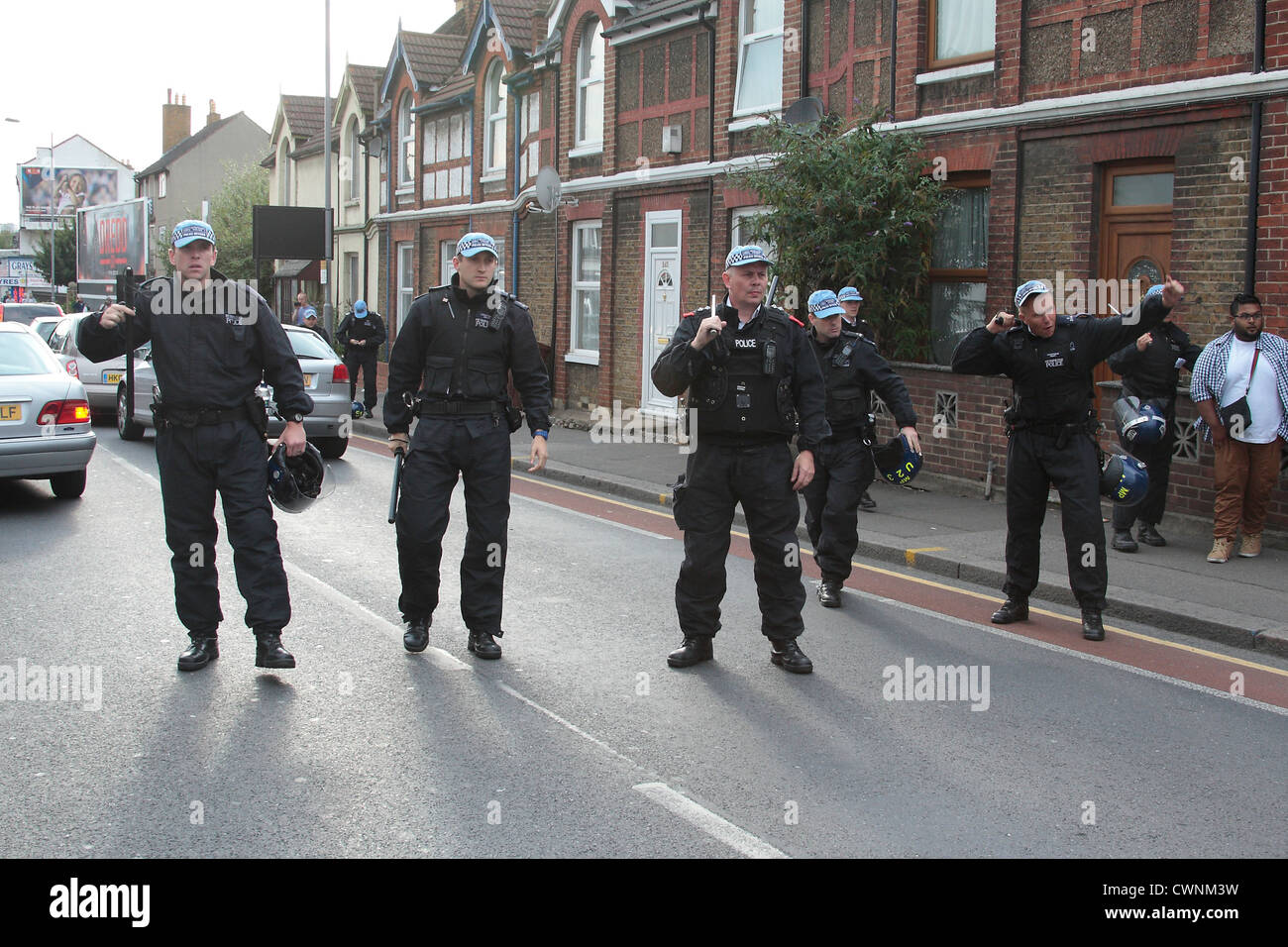 Police officers draw batons during Right Wing EDL demonstration in ...