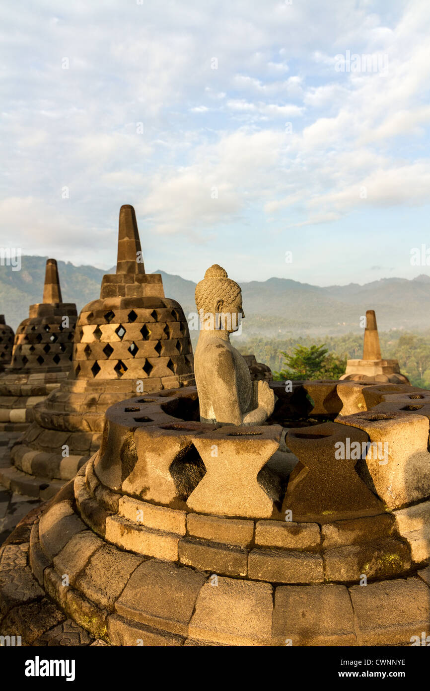 Buddha statue inside one of Borobudur temple stupas, Java island ...