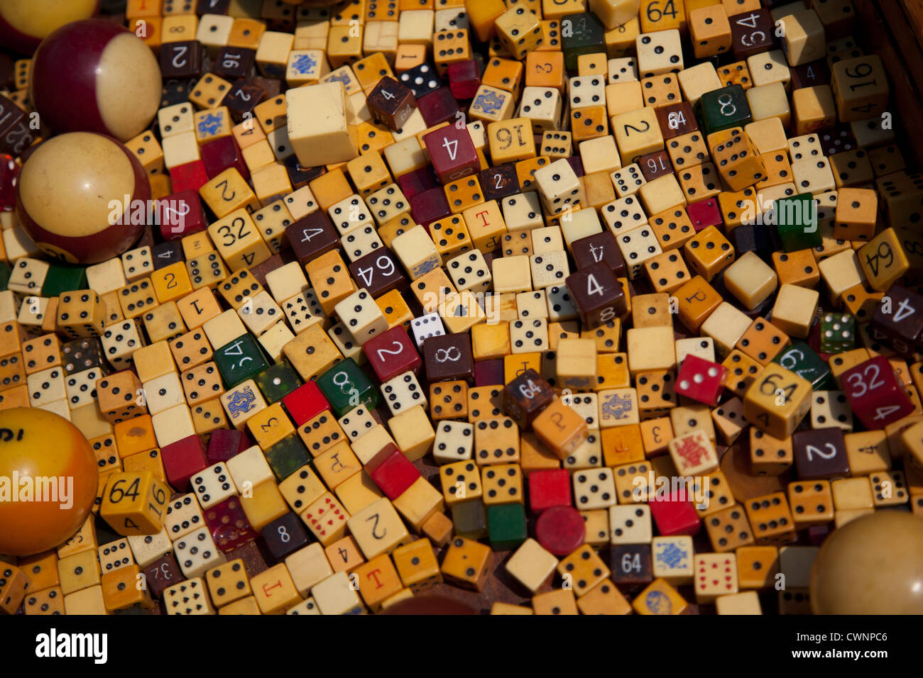 Dice and billiard balls. Still life, frame full of various types of ...