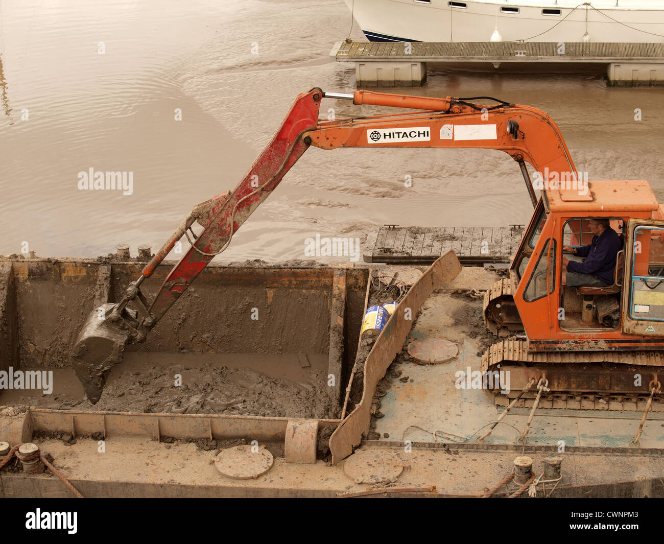 Silt being dredged from Watchet Harbour. Somerset. UK Stock Photo - Alamy