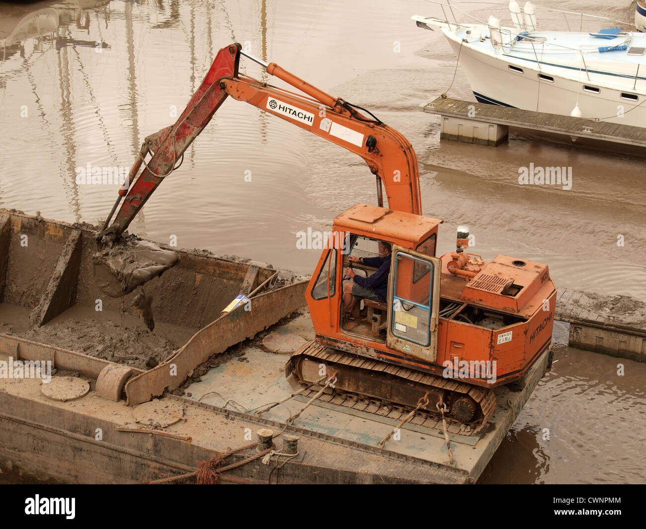 Mud being dredged out of Harbour. Watchet. Somerset Stock Photo - Alamy