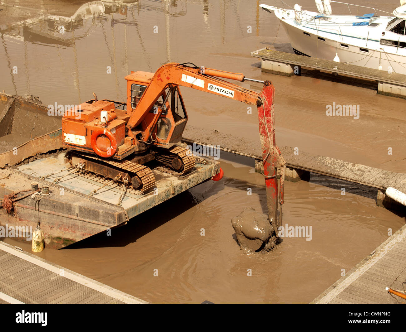 Mud being dredged out of Harbour. Watchet. Somerset Stock Photo - Alamy