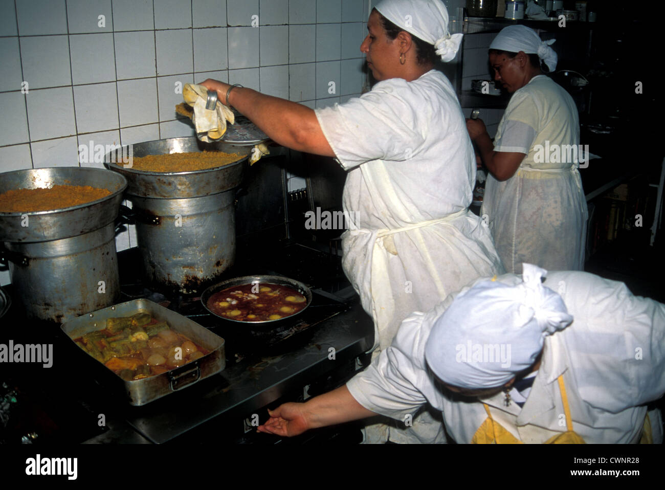 Three women chefs cooking in a restaurant Tunisia Stock Photo - Alamy