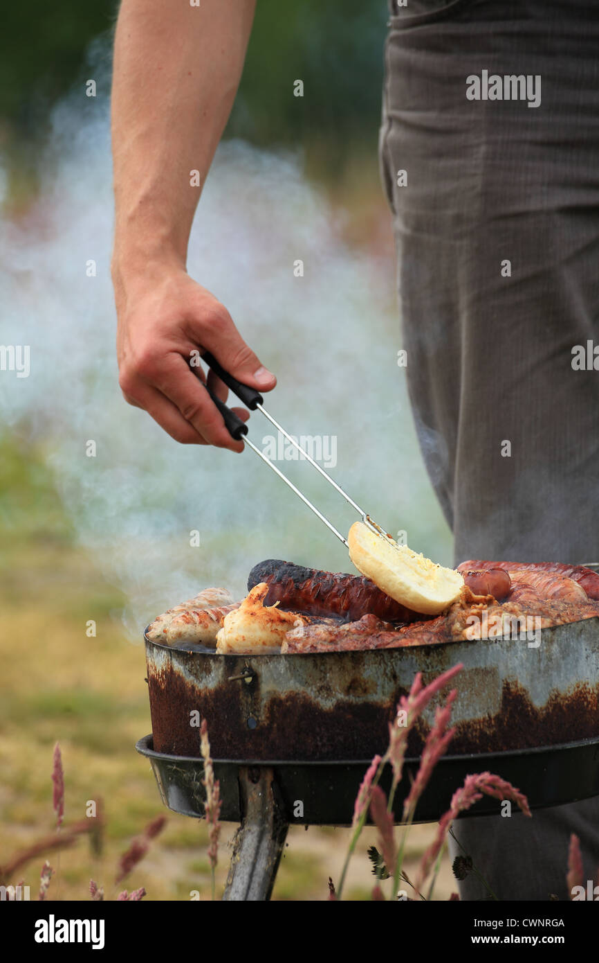 Barbecue with delicious grilled meat on grill BBQ Stock Photo - Alamy