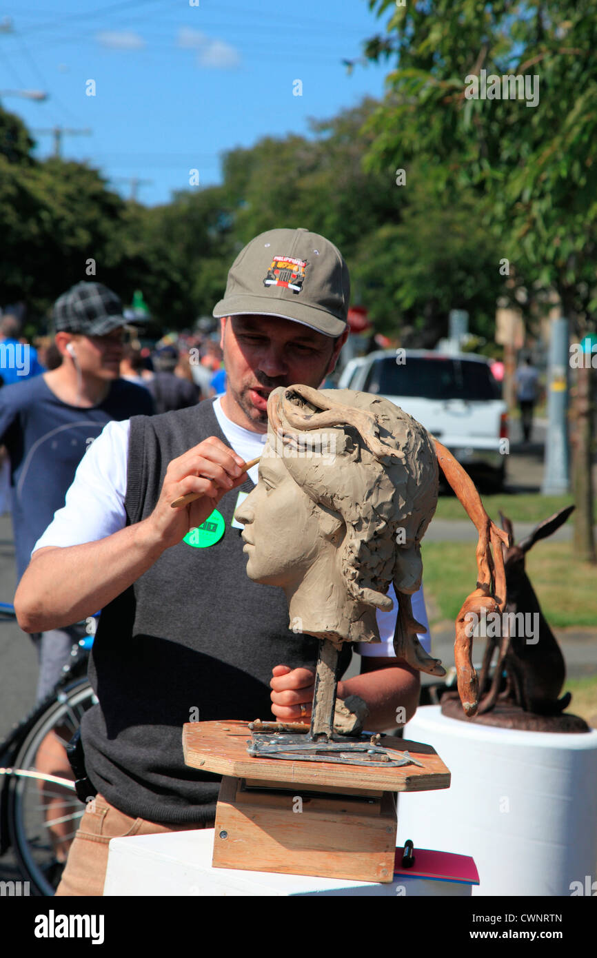 Artist making sculpture at street art show hi-res stock photography and ...