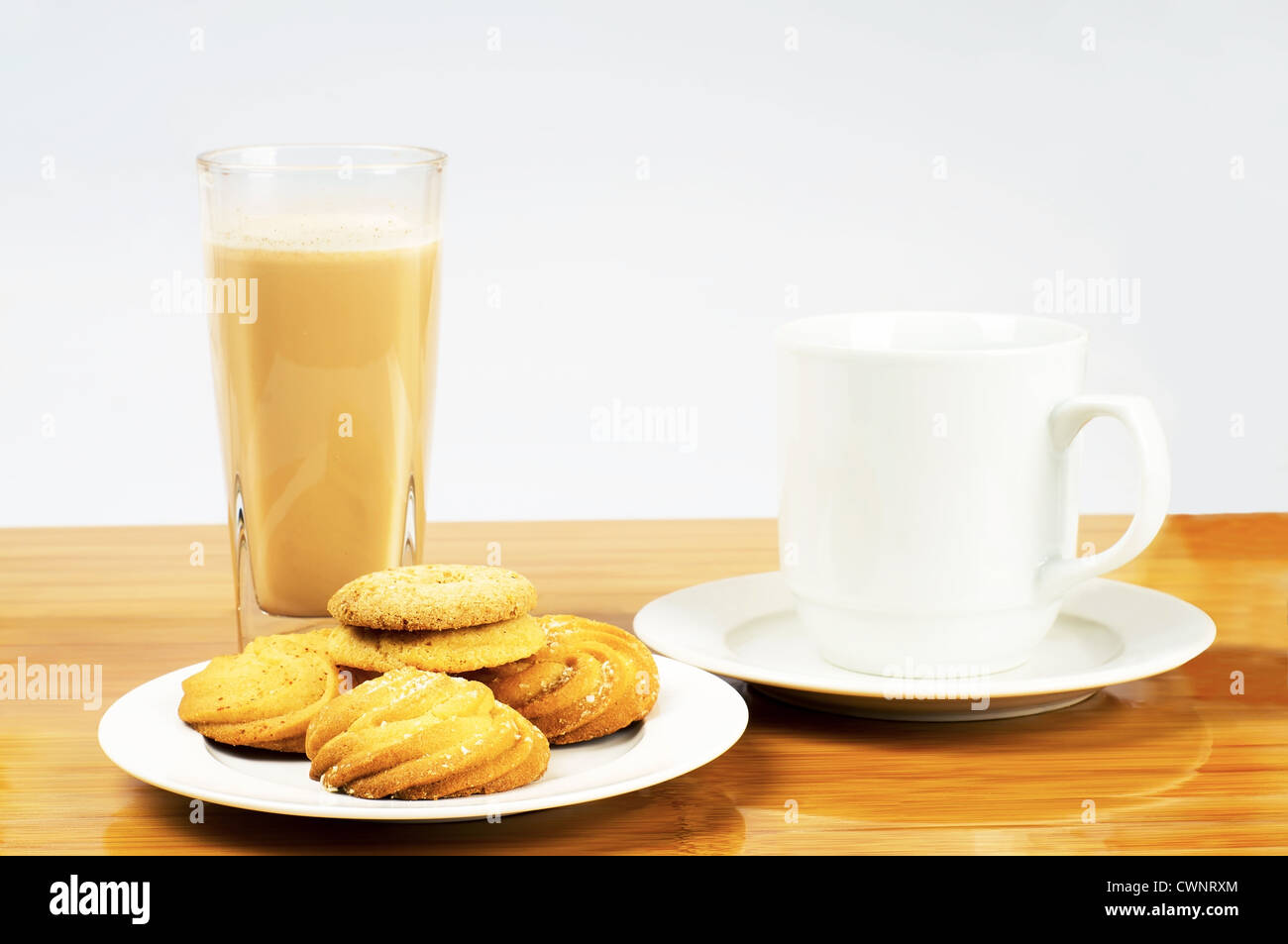 Cookies and milk tea breakfast collocation Stock Photo - Alamy