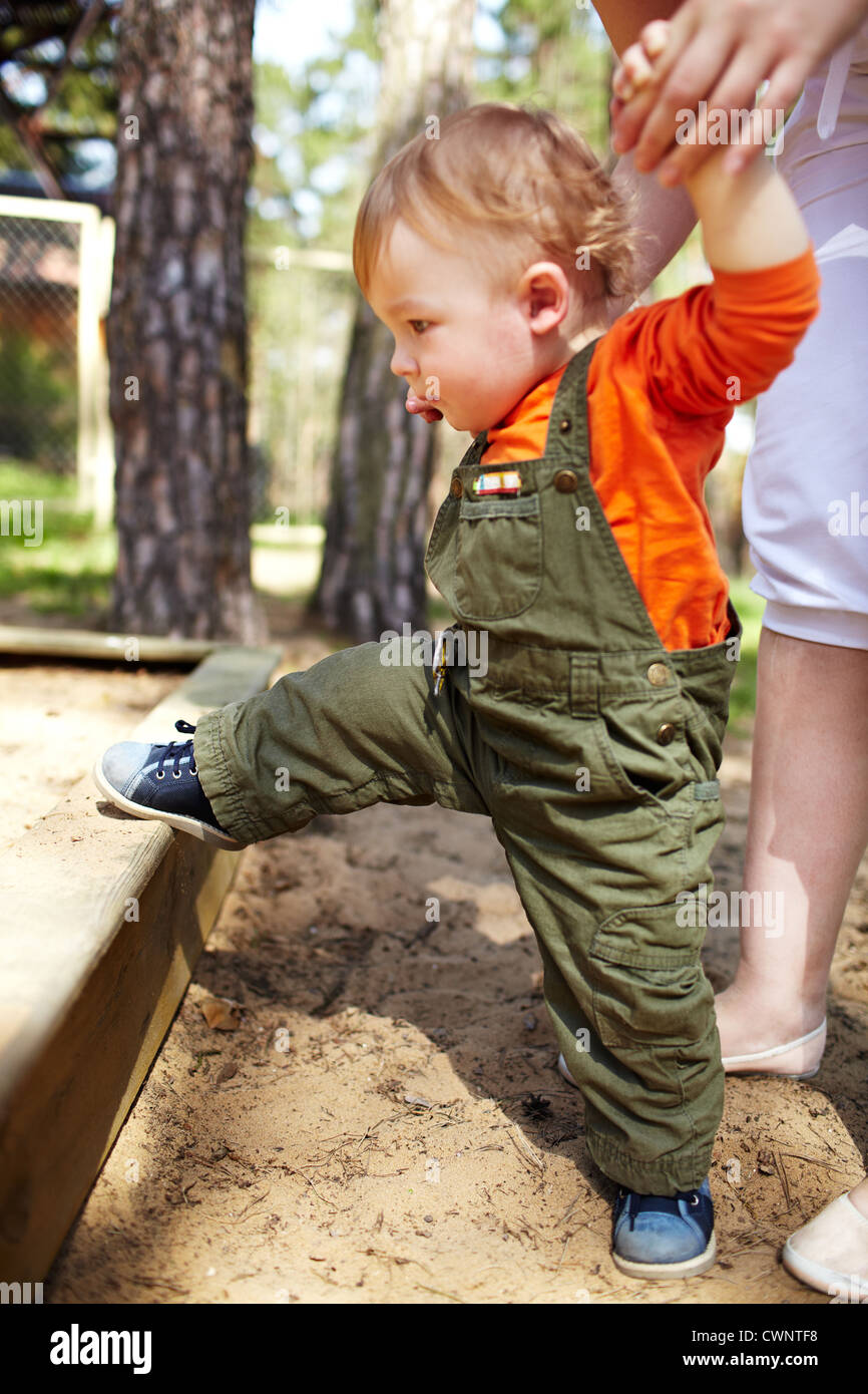 The first steps of the kid. Outdoors Stock Photo - Alamy
