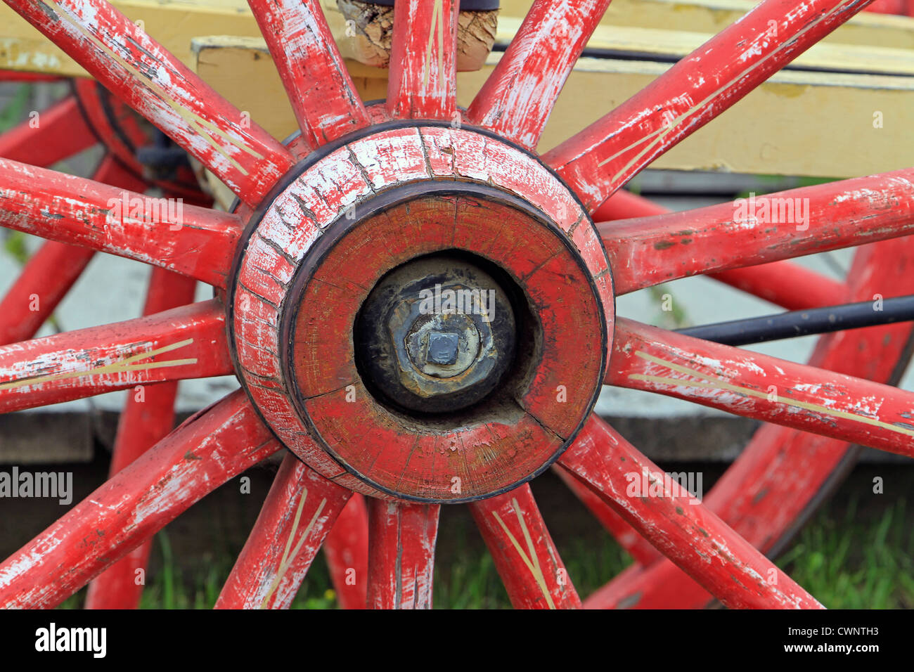 Old, antique wagon wheel with weathered wood and rusty metal parts in a ...