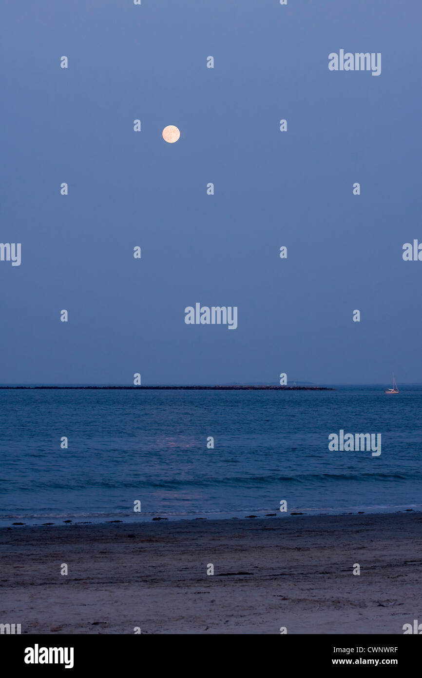 Shoreline at Dusk. High Tide on the Atlantic Ocean as a Full Moon rises ...
