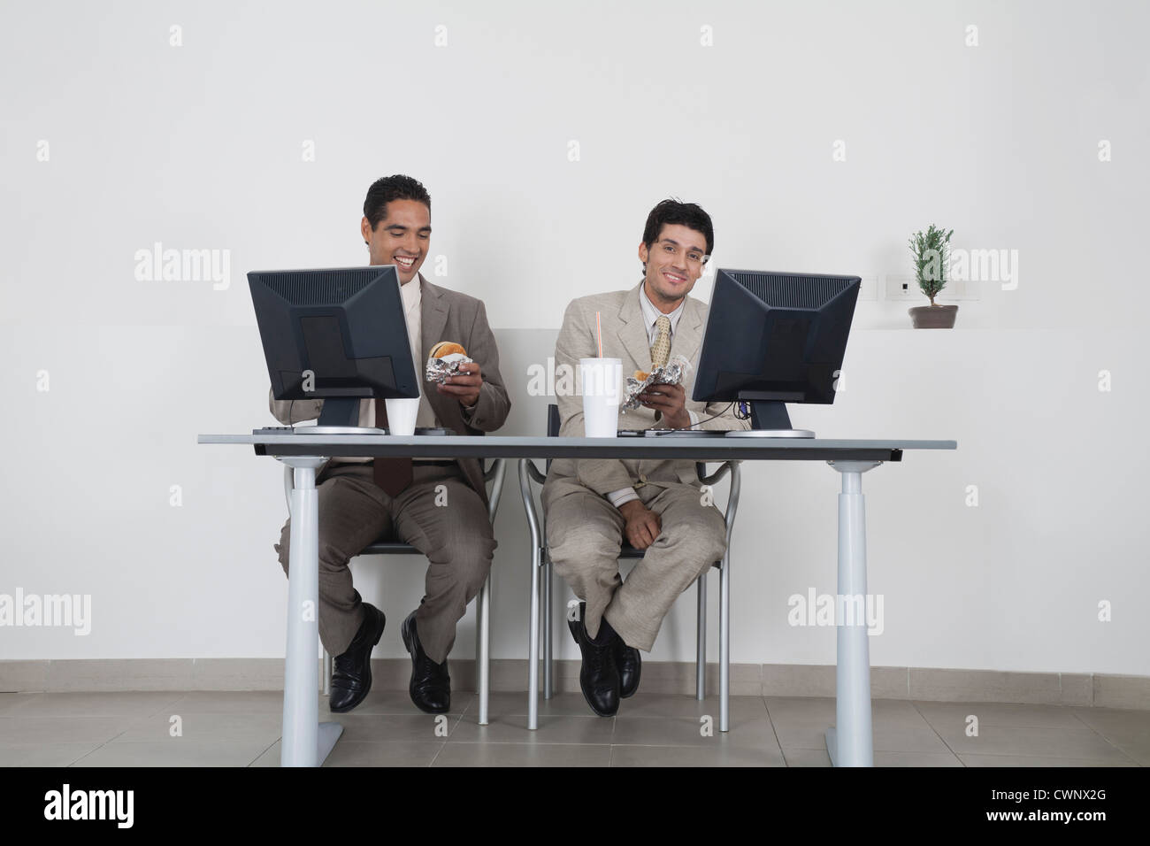 Unhealthy Eating At Desk High Resolution Stock Photography and Images ...