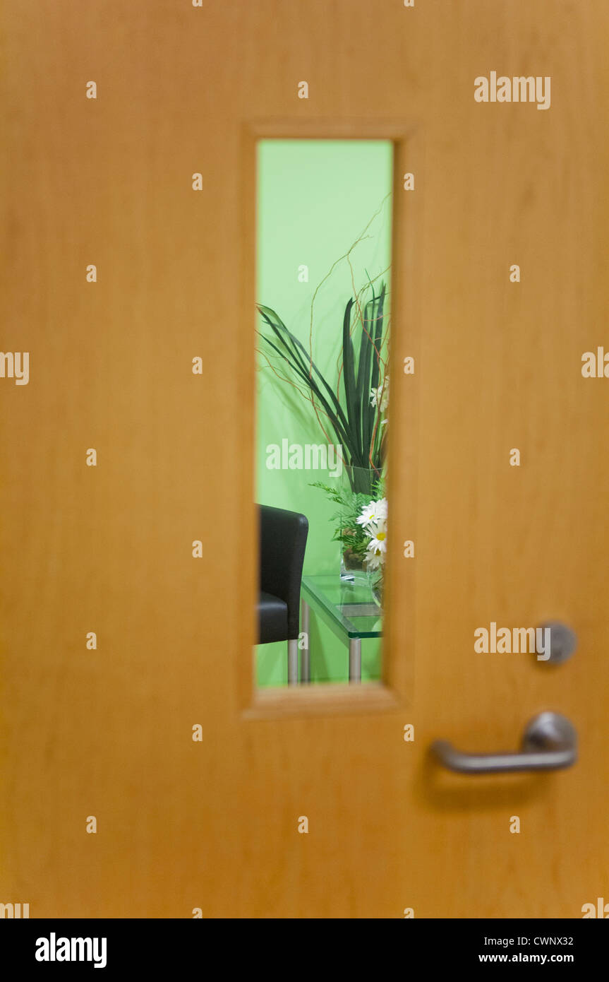 Waiting room viewed through window Stock Photo - Alamy