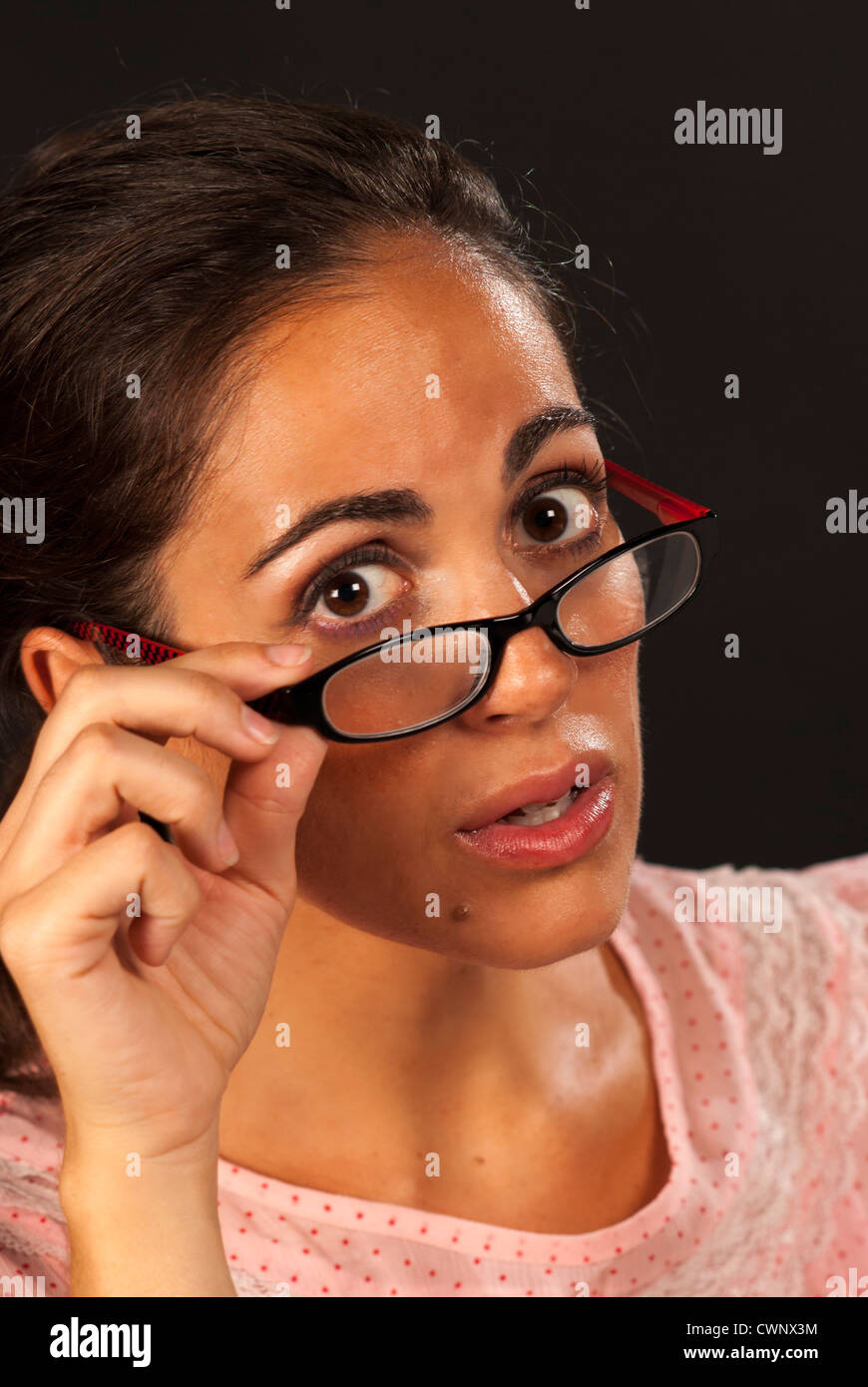 A nerd female giving the camera a reproachful look Stock Photo - Alamy