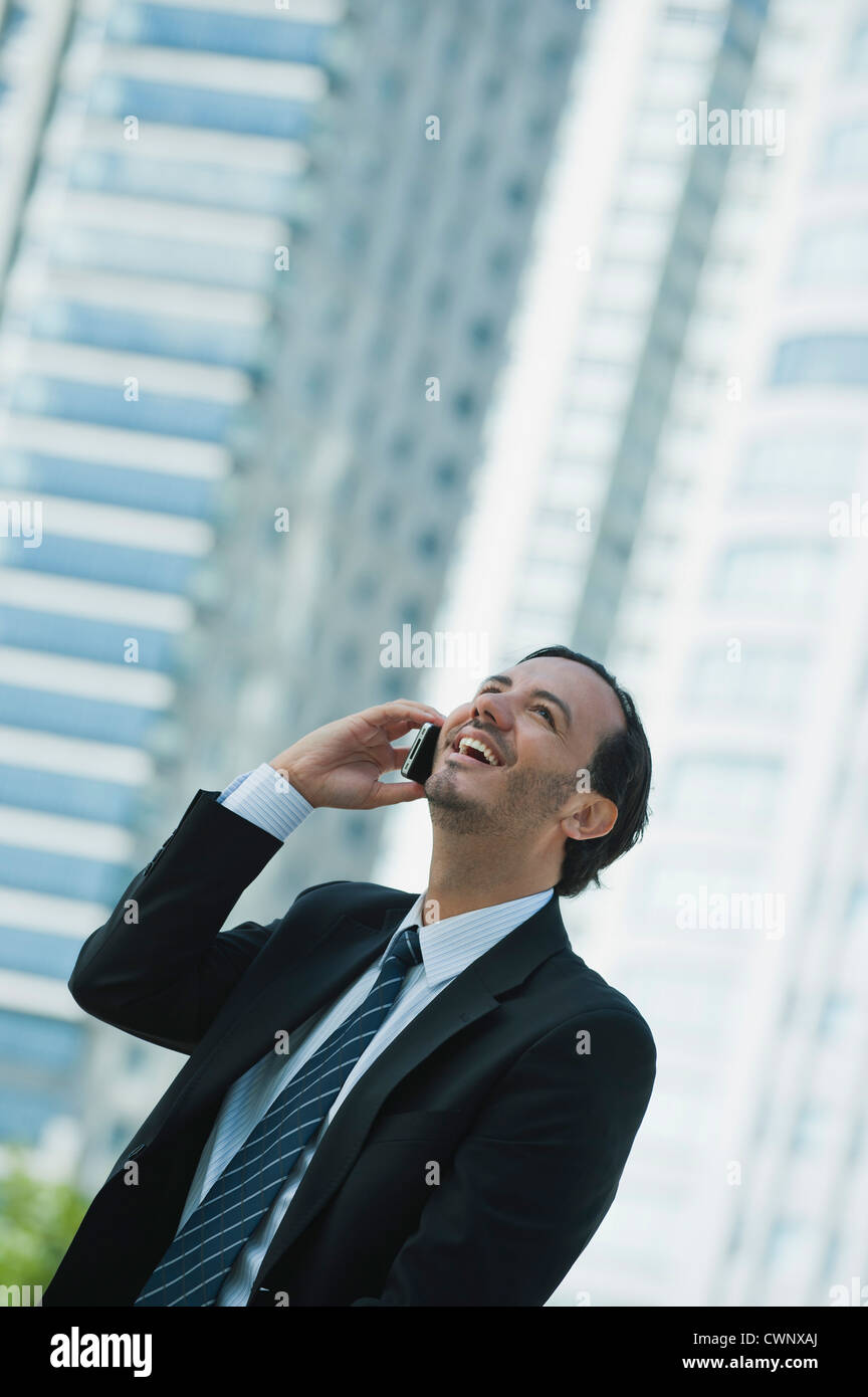 Business executive using cell phone outdoors Stock Photo - Alamy