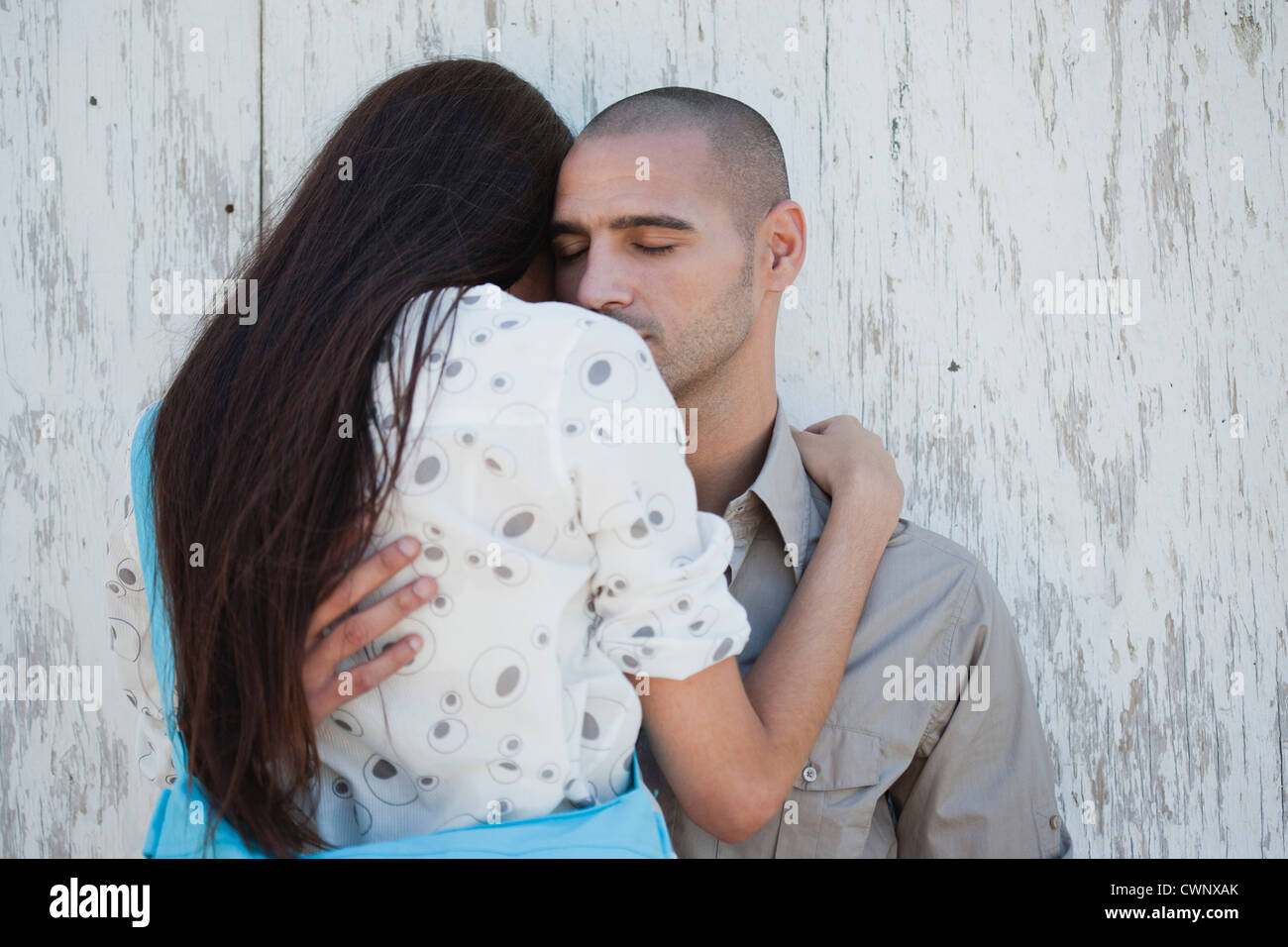 Couple embracing with eyes closed Stock Photo - Alamy