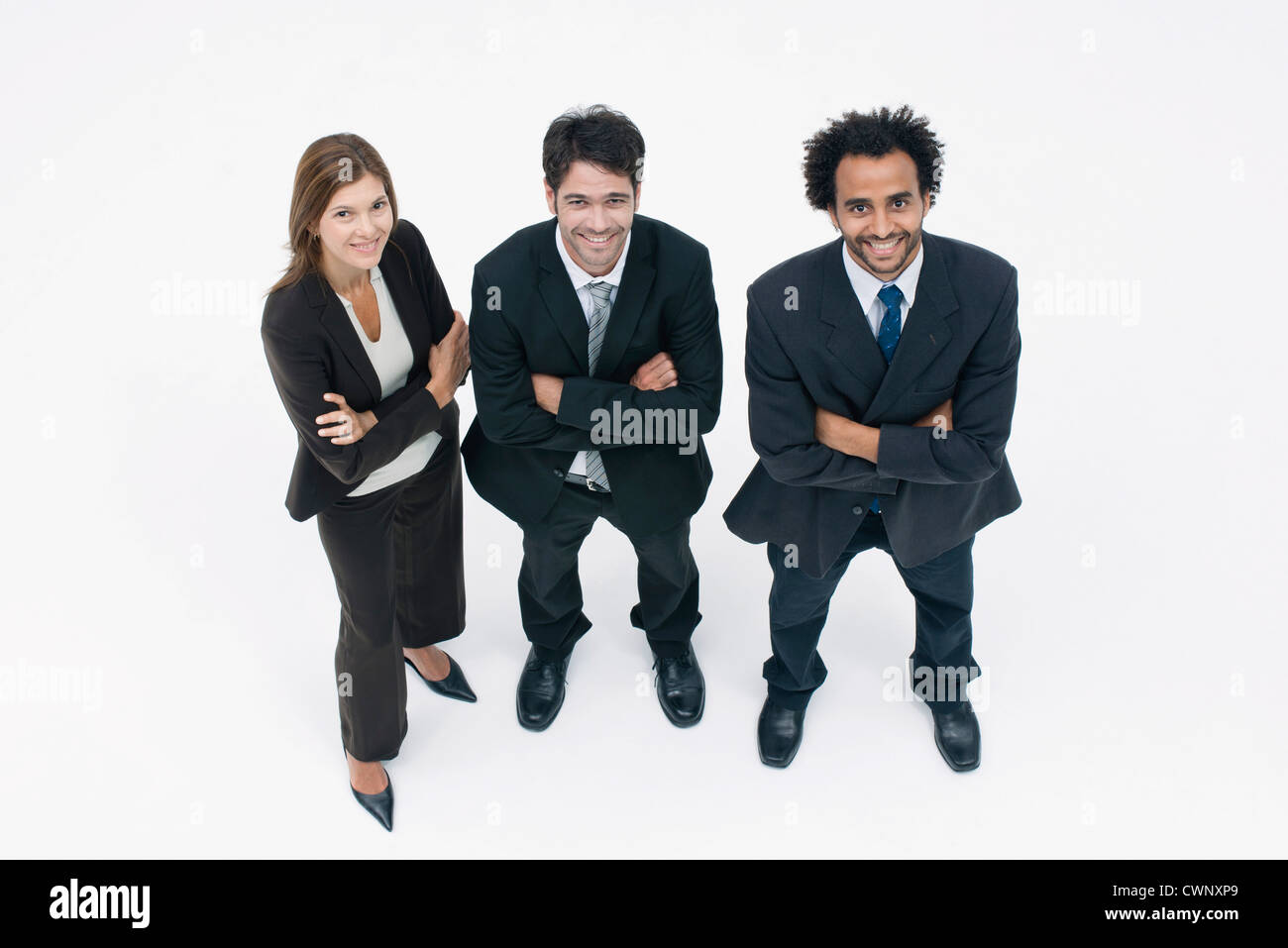 Executives standing together with arms folded, portrait Stock Photo - Alamy