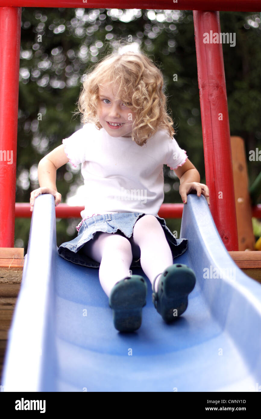 girl playing on the slide Stock Photo - Alamy