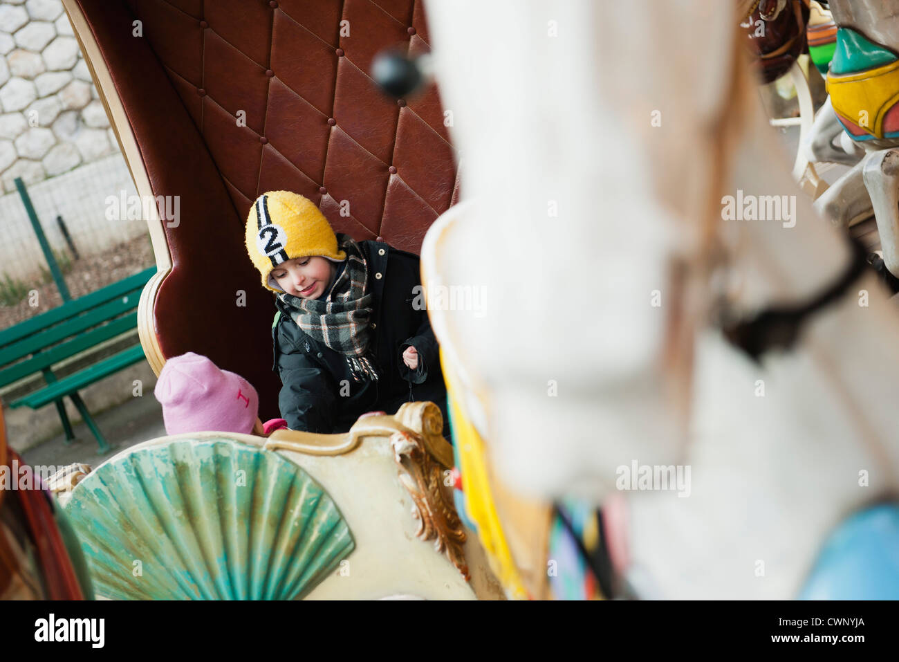 Children riding on carousel Stock Photo - Alamy