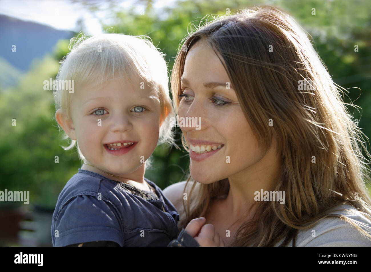 Germany, Bavaria, Mother and daughter smiling Stock Photo - Alamy