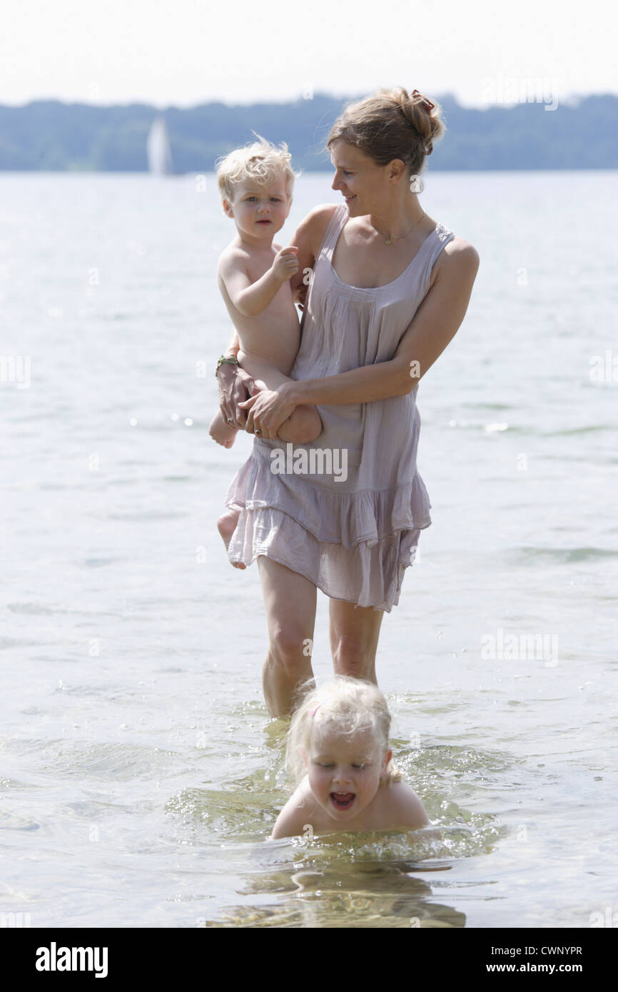 Germany, Bavaria, Family enjoying at Lake Starnberg, smiling Stock ...