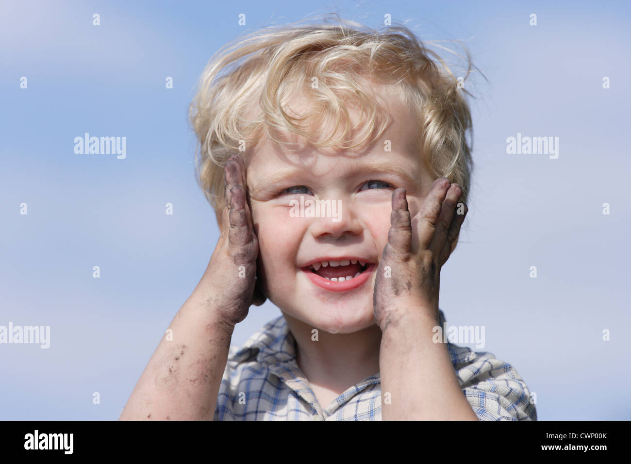 Germany, Bavaria, Boy playing with charcoal, smiling Stock Photo - Alamy