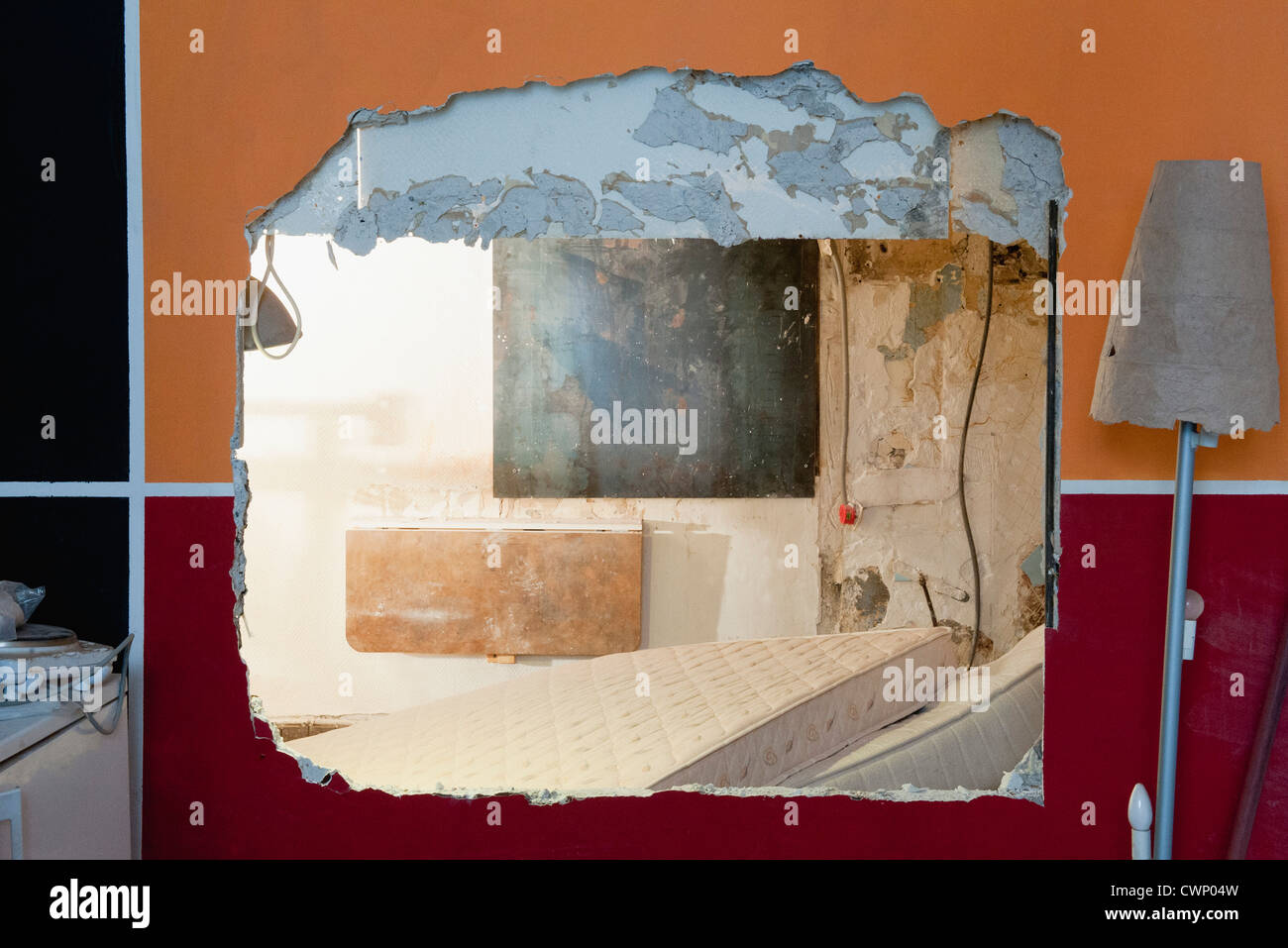 Large hole in wall at demolition site Stock Photo - Alamy