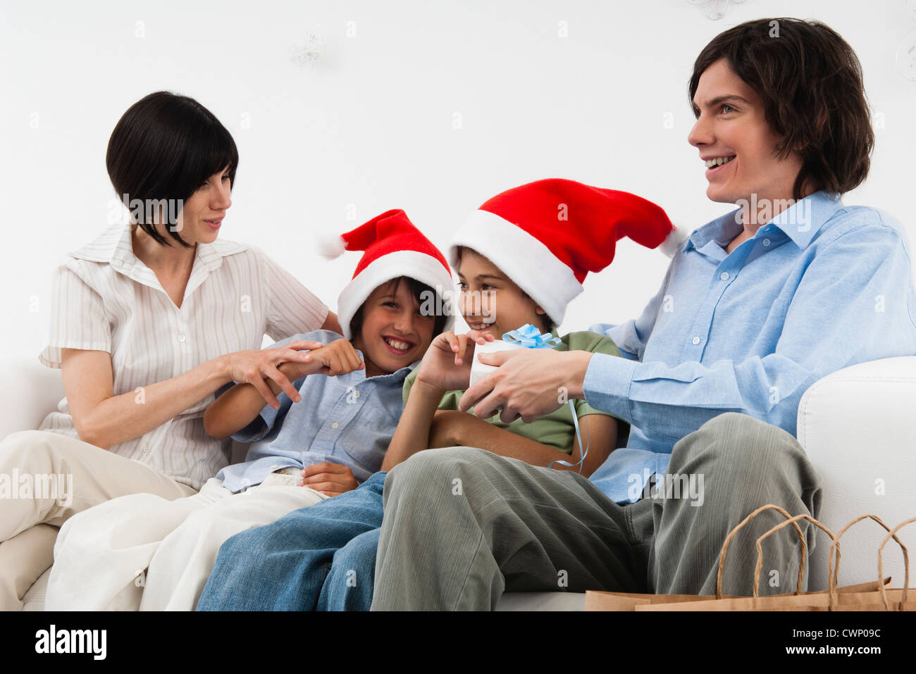 Family celebrating Christmas together Stock Photo - Alamy