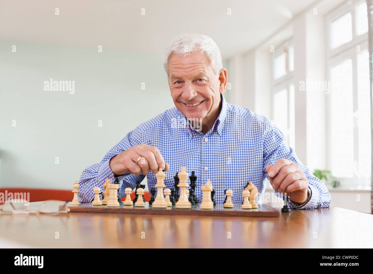 Germany, Leipzig, Senior man playing chess game Stock Photo - Alamy