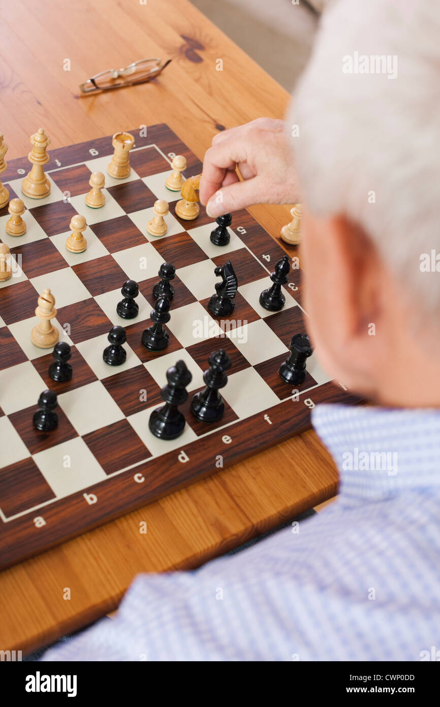 Germany, Leipzig, Senior man playing chess game Stock Photo - Alamy