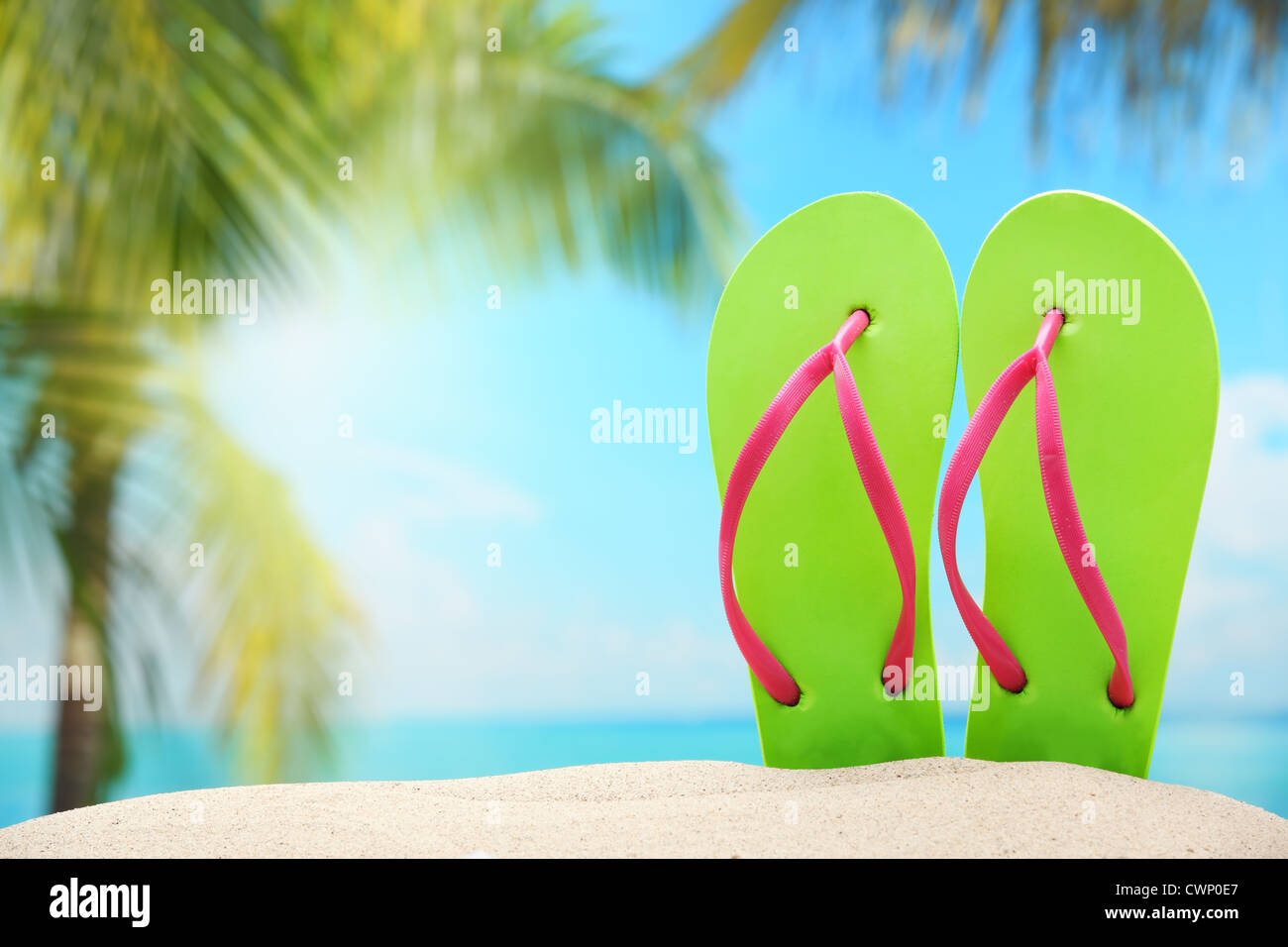 Flip-flops on sand beach Stock Photo - Alamy