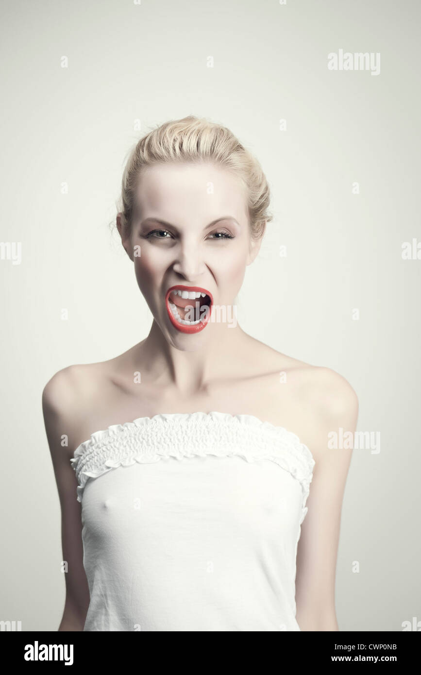 Young woman shouting, portrait Stock Photo - Alamy