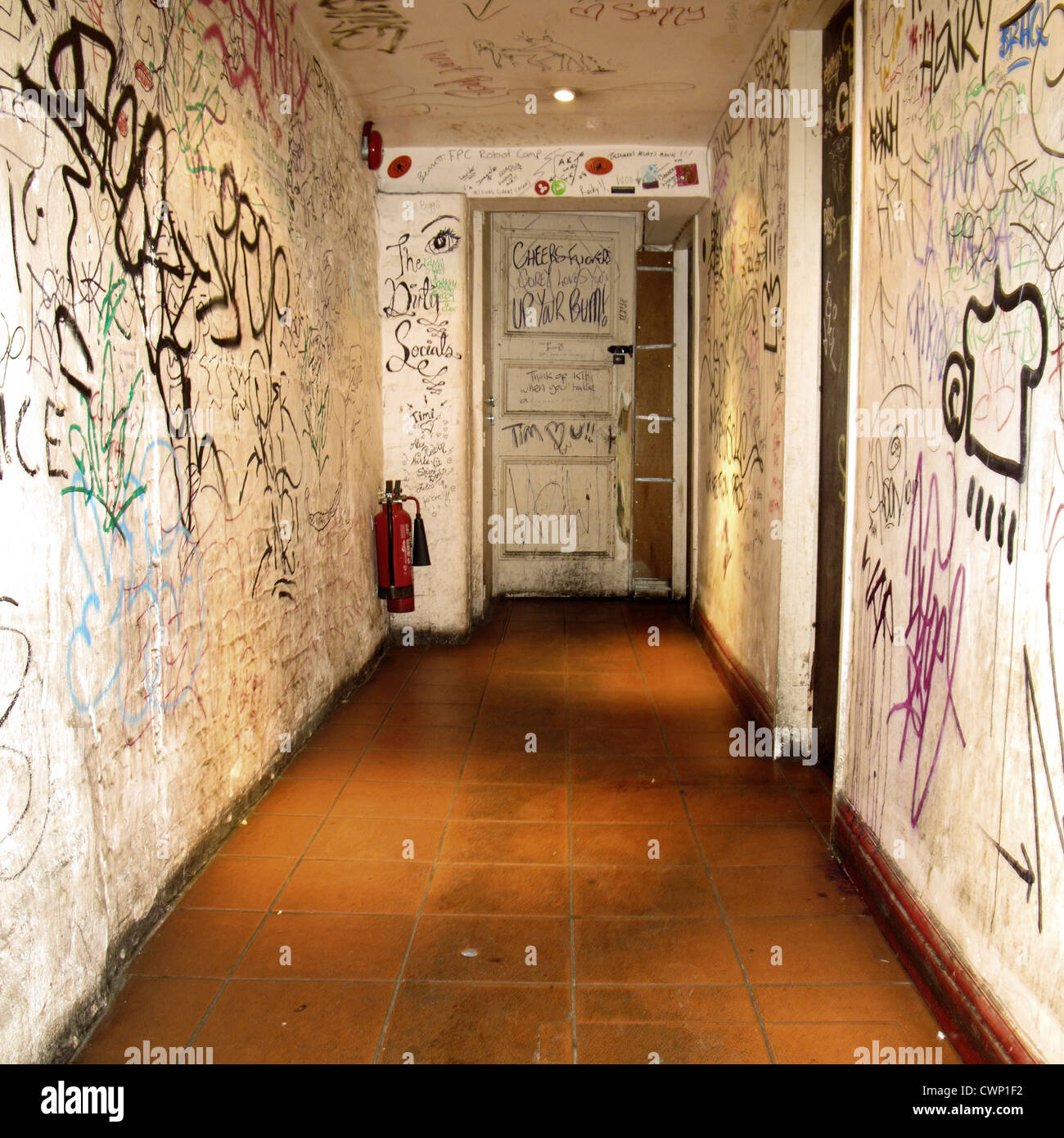 Corridor walls covered with graffiti Stock Photo - Alamy