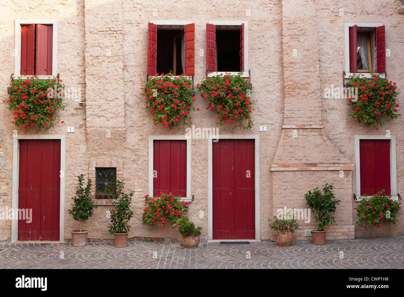 Italy, Province of Venice, Facade of building with flowerpots Stock ...