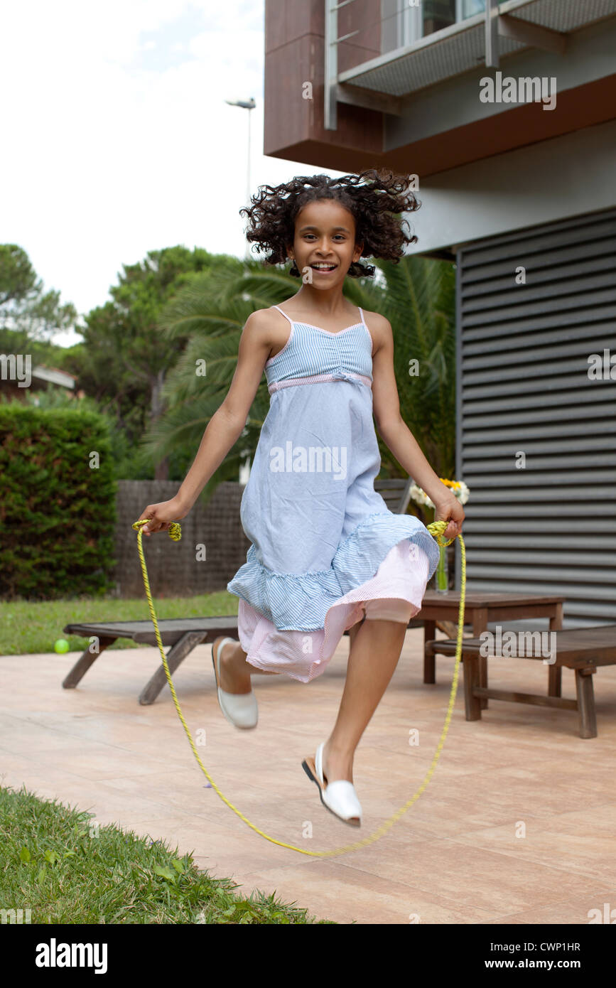 Girl jumping rope Stock Photo - Alamy