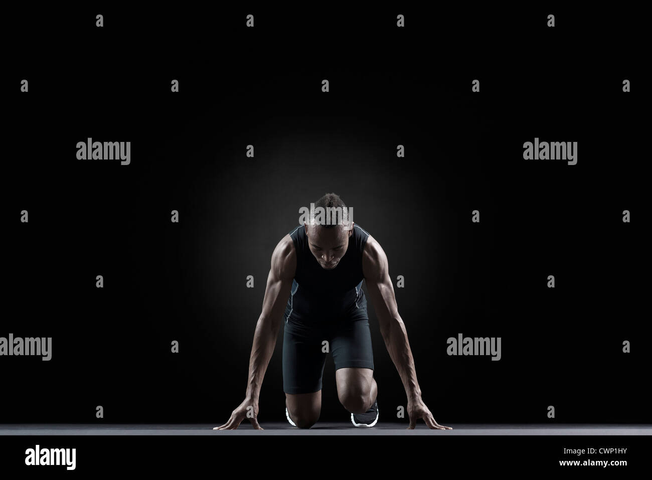 Runner at starting line Stock Photo - Alamy