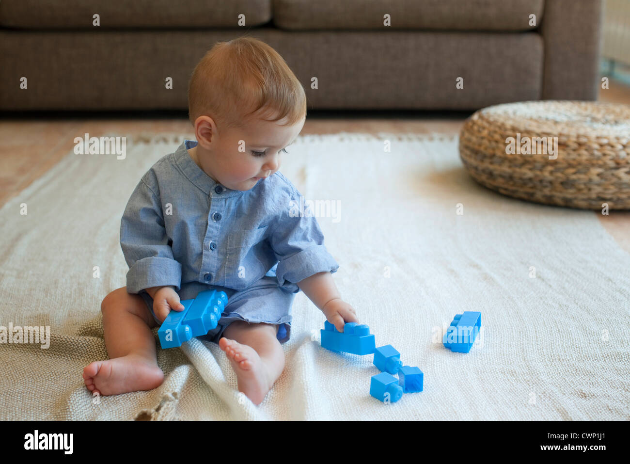 Baby boy playing with building blocks Stock Photo - Alamy
