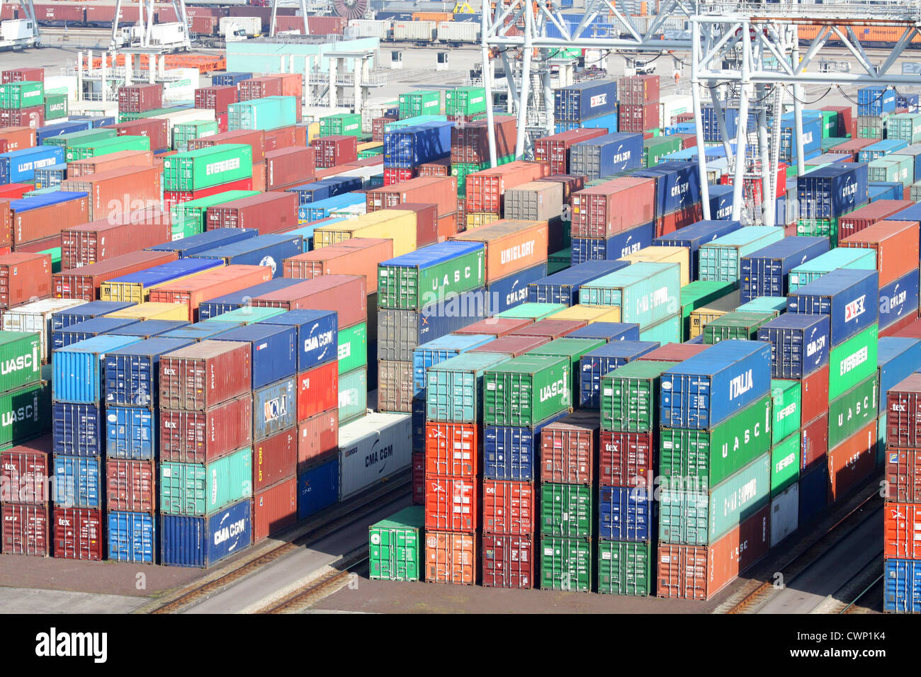 Shipping containers on quayside at Rotterdam, awaiting loading onto a ...