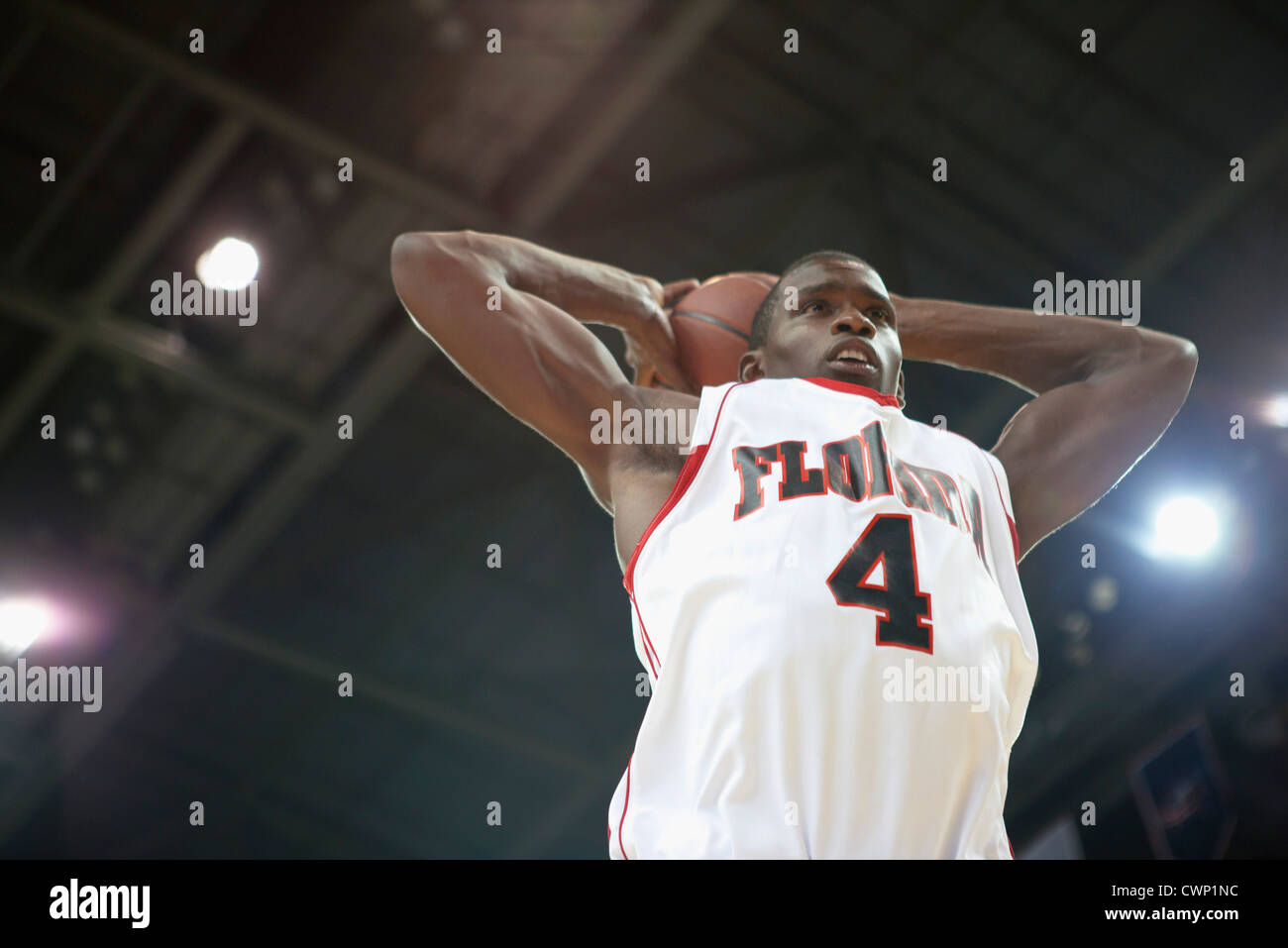 Basketball player shooting basketball, low angle view Stock Photo - Alamy