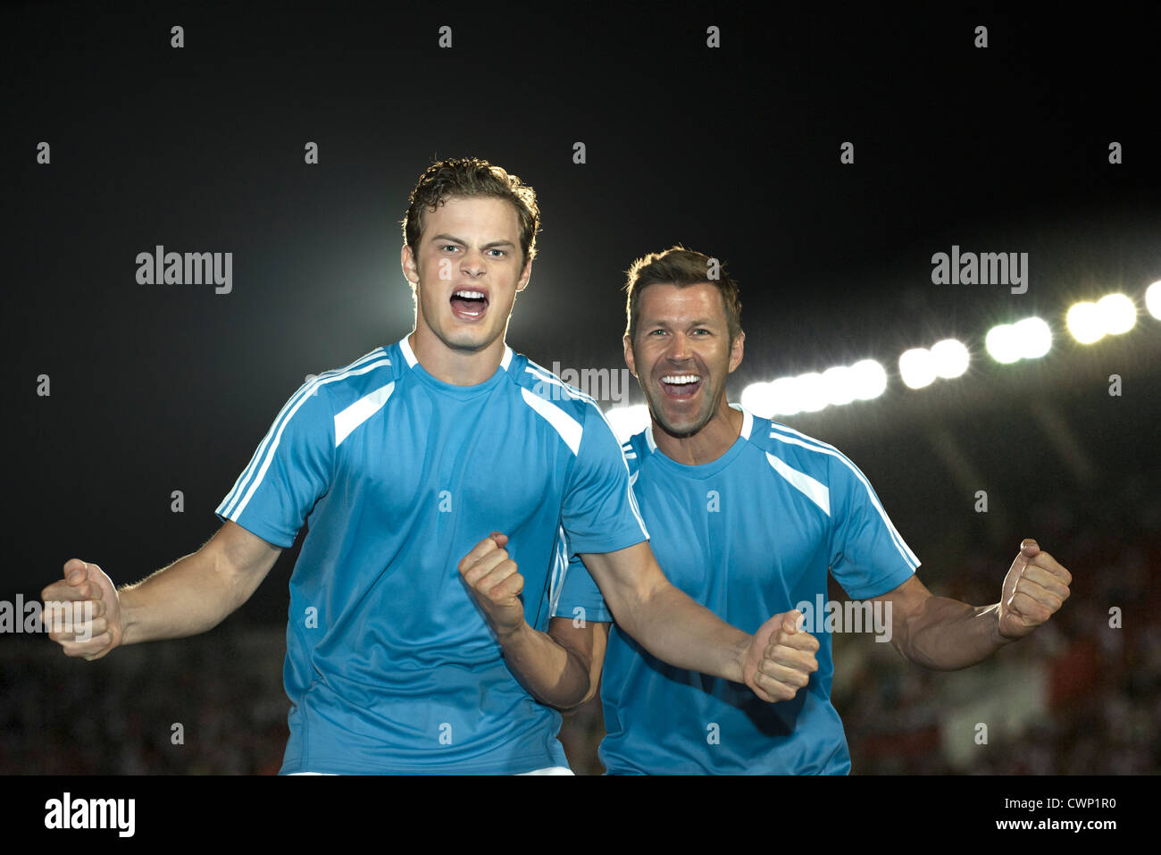 Soccer players cheering, portrait Stock Photo - Alamy