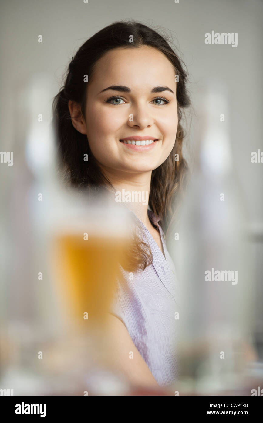 Beautiful young woman, focus on background Stock Photo - Alamy
