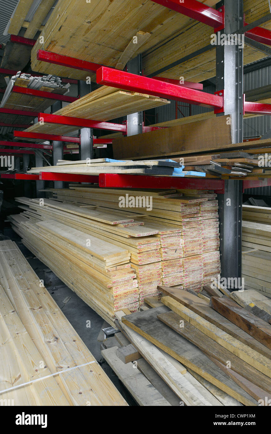 Stacked wood in timber merchant warehouse Stock Photo - Alamy