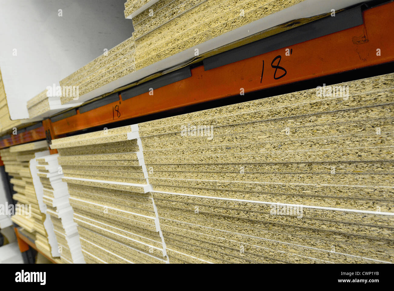 Stacked wood in timber merchant warehouse Stock Photo - Alamy