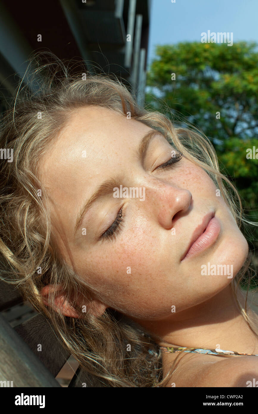Woman relaxing with eyes closed, portrait Stock Photo - Alamy