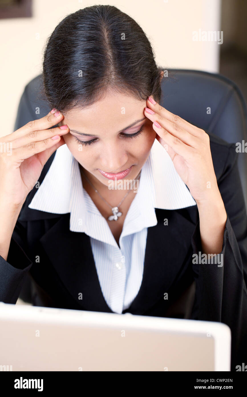 Stressed businesswoman at work Stock Photo - Alamy