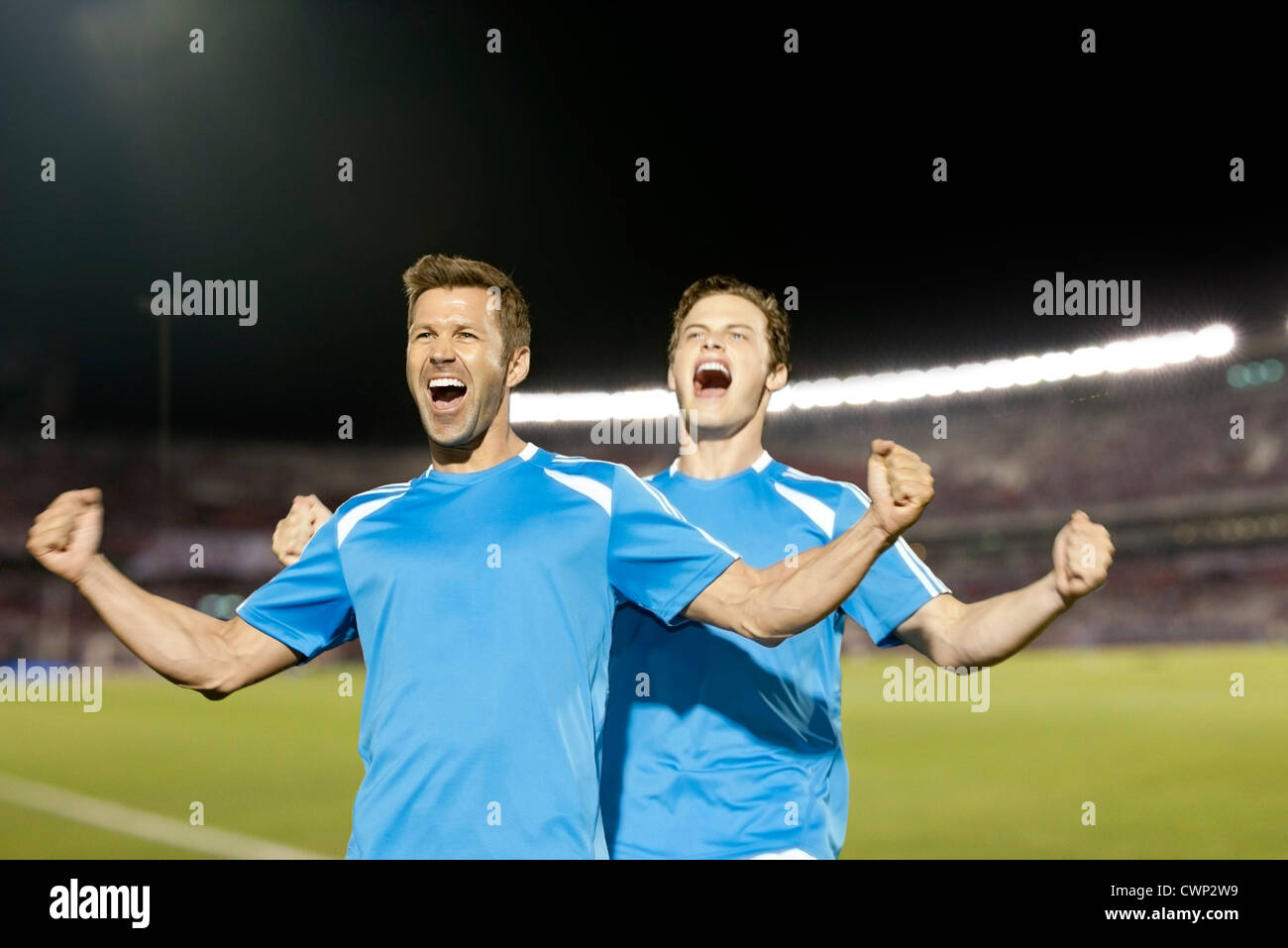 Soccer players celebrating, portrait Stock Photo - Alamy