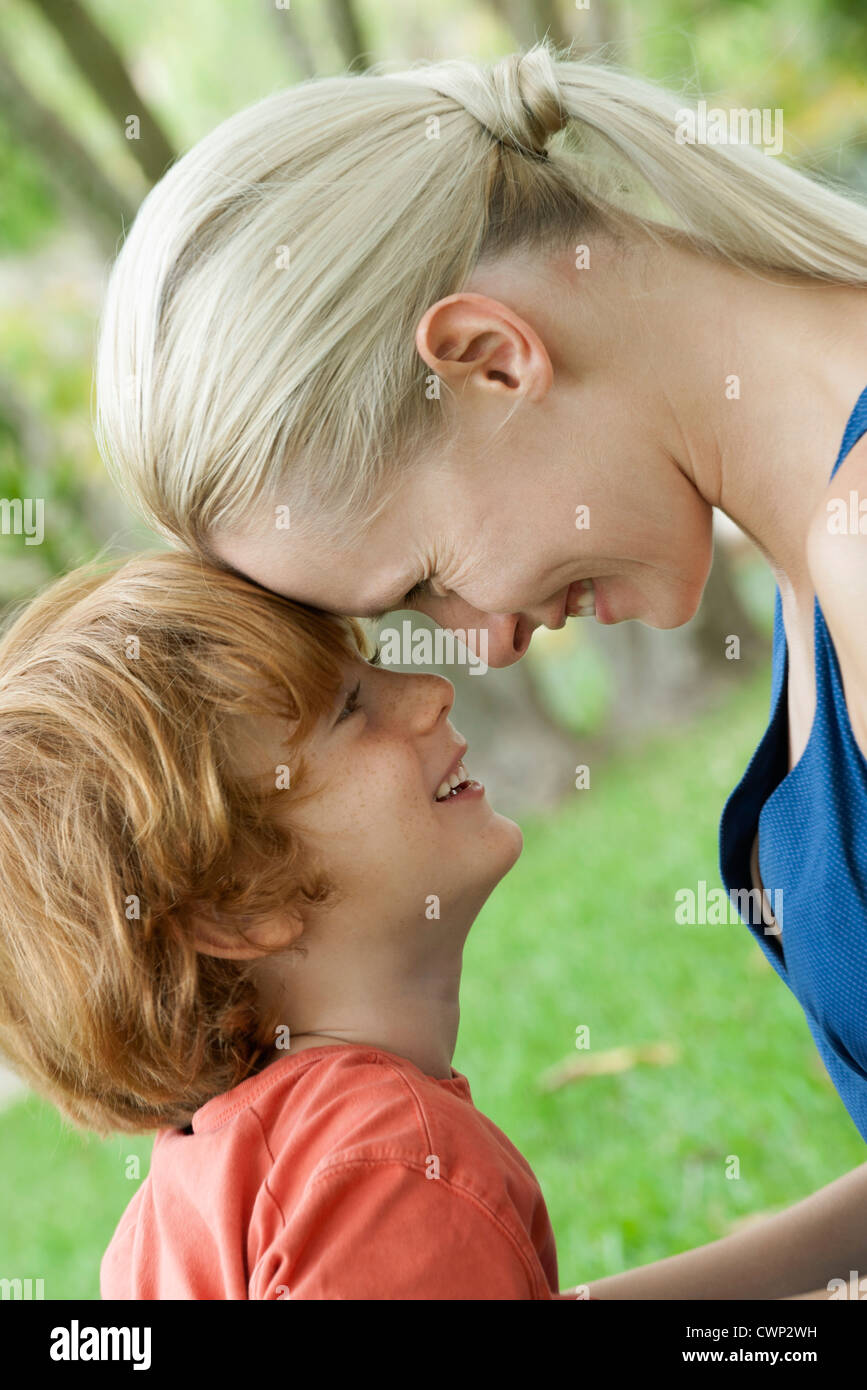 Mother and young son touching foreheads Stock Photo - Alamy